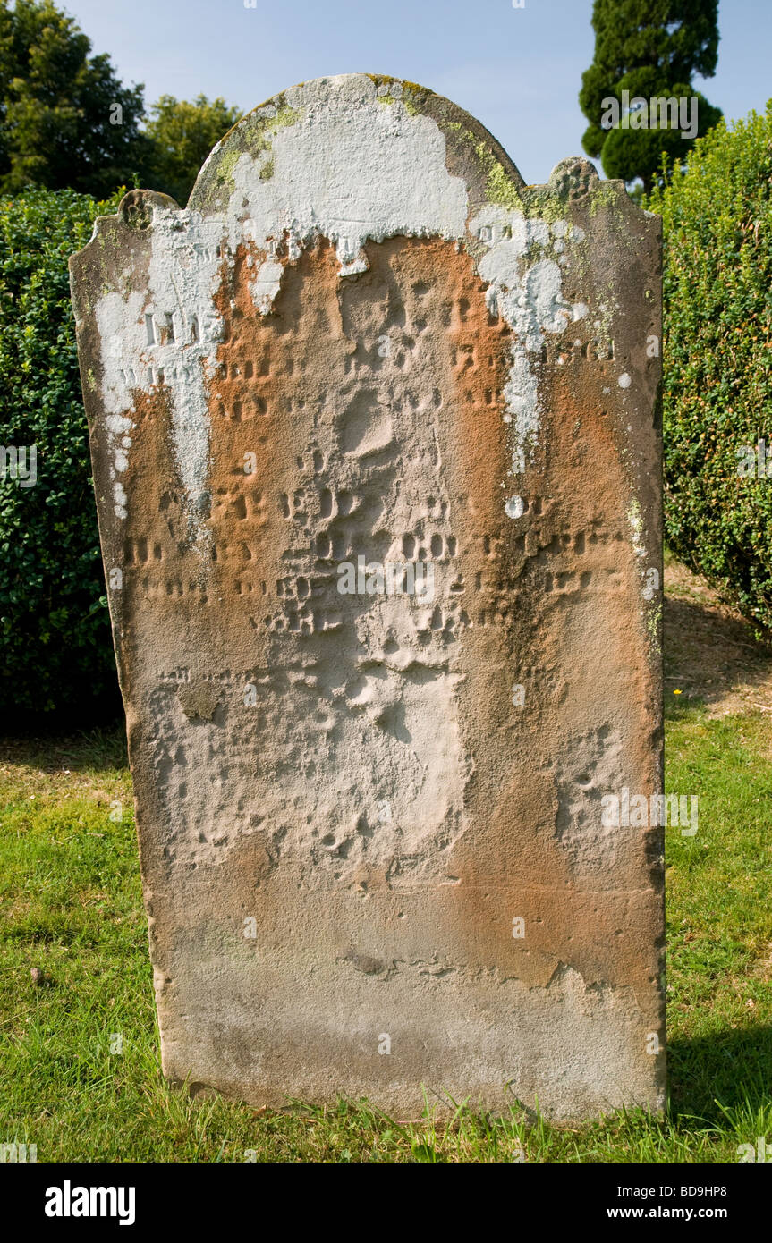 A weathered and unreadable grave stone Stock Photo - Alamy