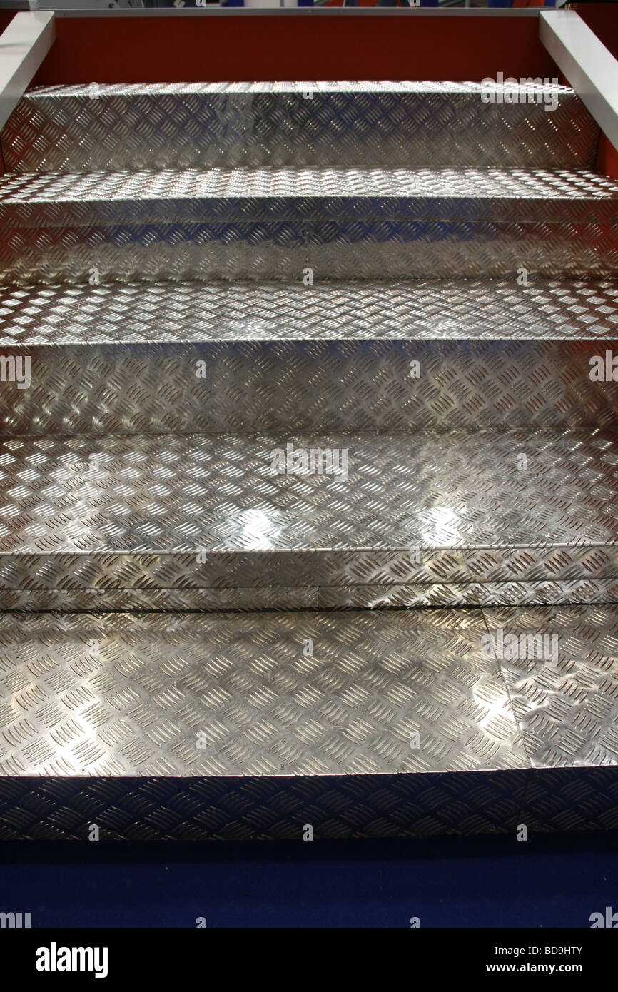 empty metal steps and blue carpet in exhibition hall Stock Photo - Alamy