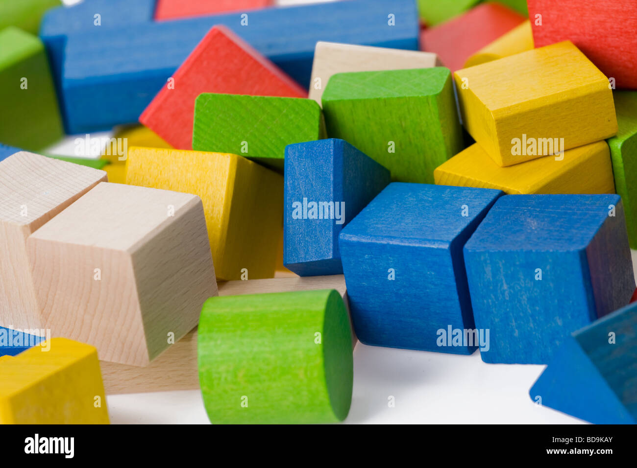 Wooden toy blocks on white background Stock Photo - Alamy
