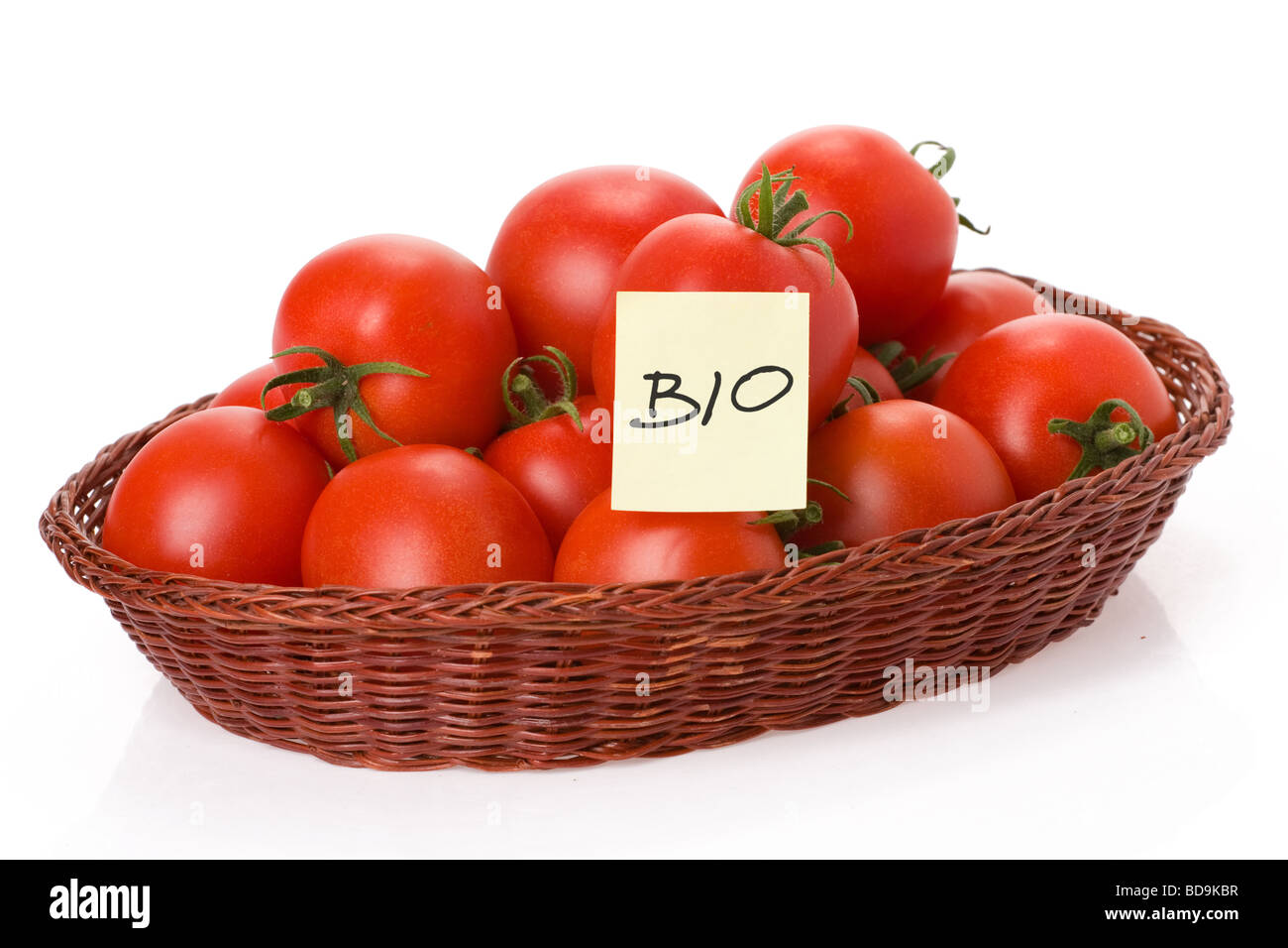 the red bio tomatoes in basket Stock Photo - Alamy