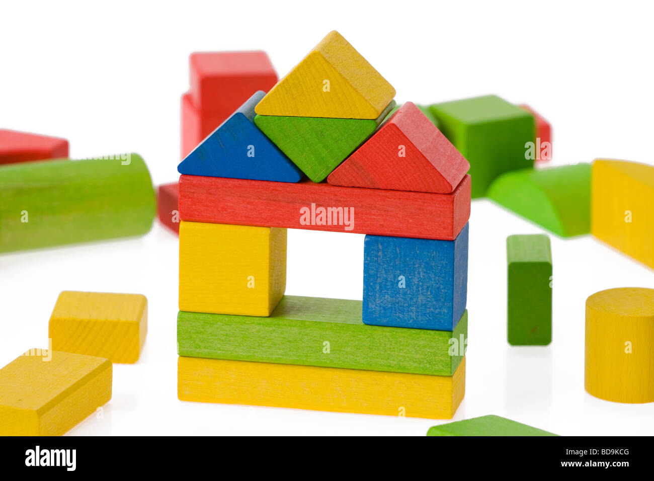 Wooden toy blocks on white background Stock Photo - Alamy