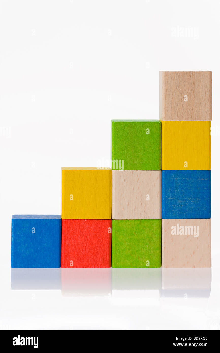 Wooden toy blocks on white background Stock Photo - Alamy