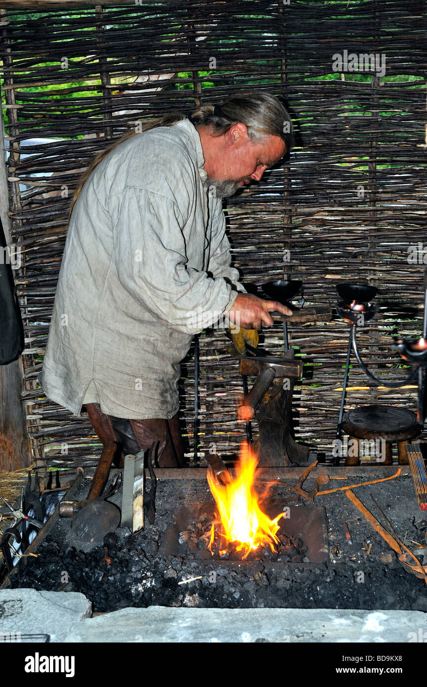A Blacksmith works to forge steel Stock Photo - Alamy