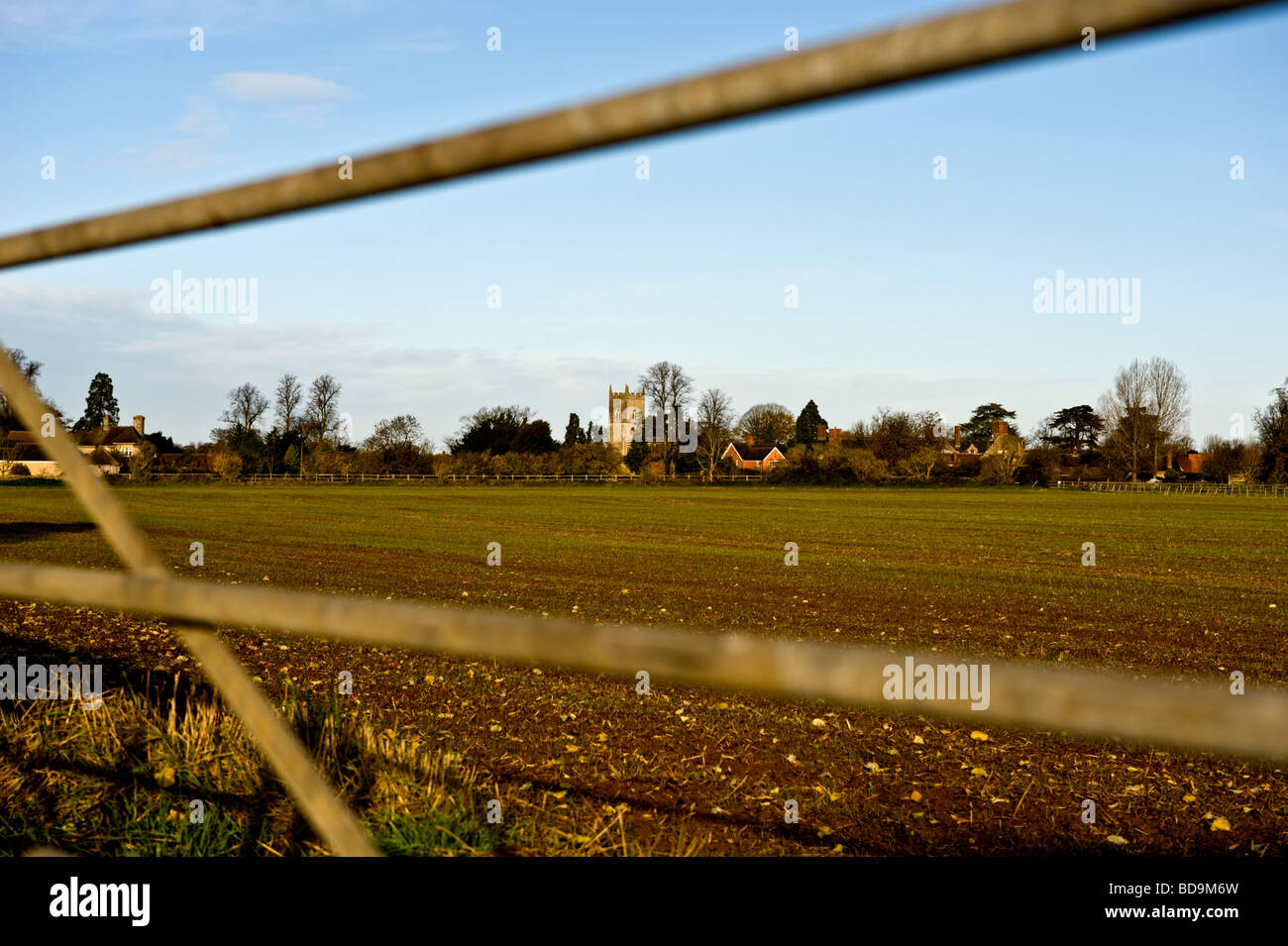 A view of Stratton Audley through a gate Stock Photo - Alamy