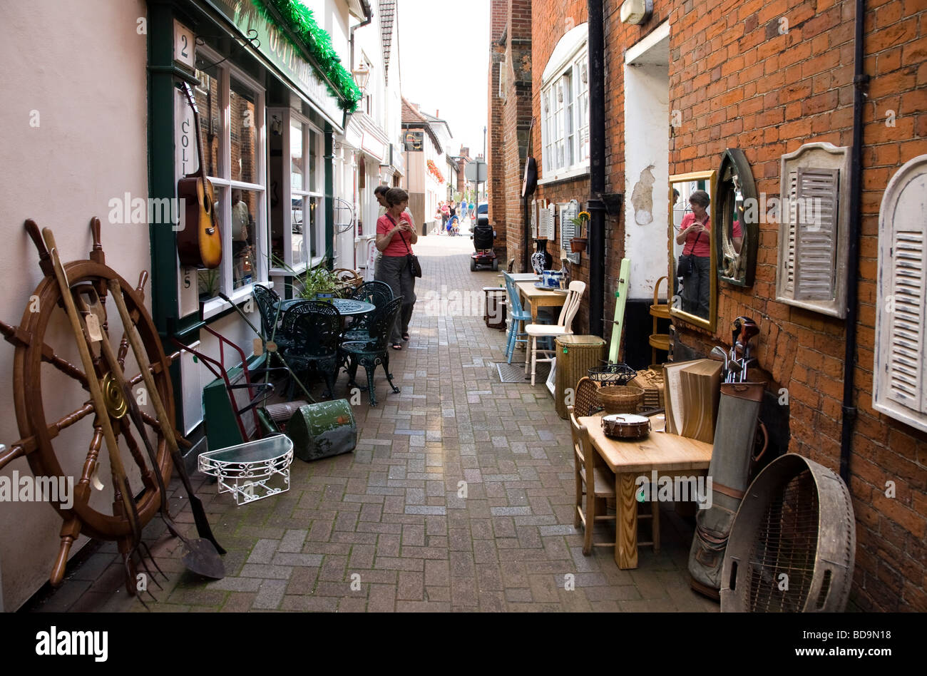 SHOPS IN A NARROW STREET IN MANNINGTREE, BRITAINS SMALLEST TOWN. THIS ...