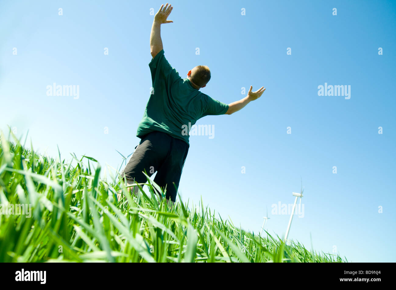 Happy man on the field Stock Photo - Alamy