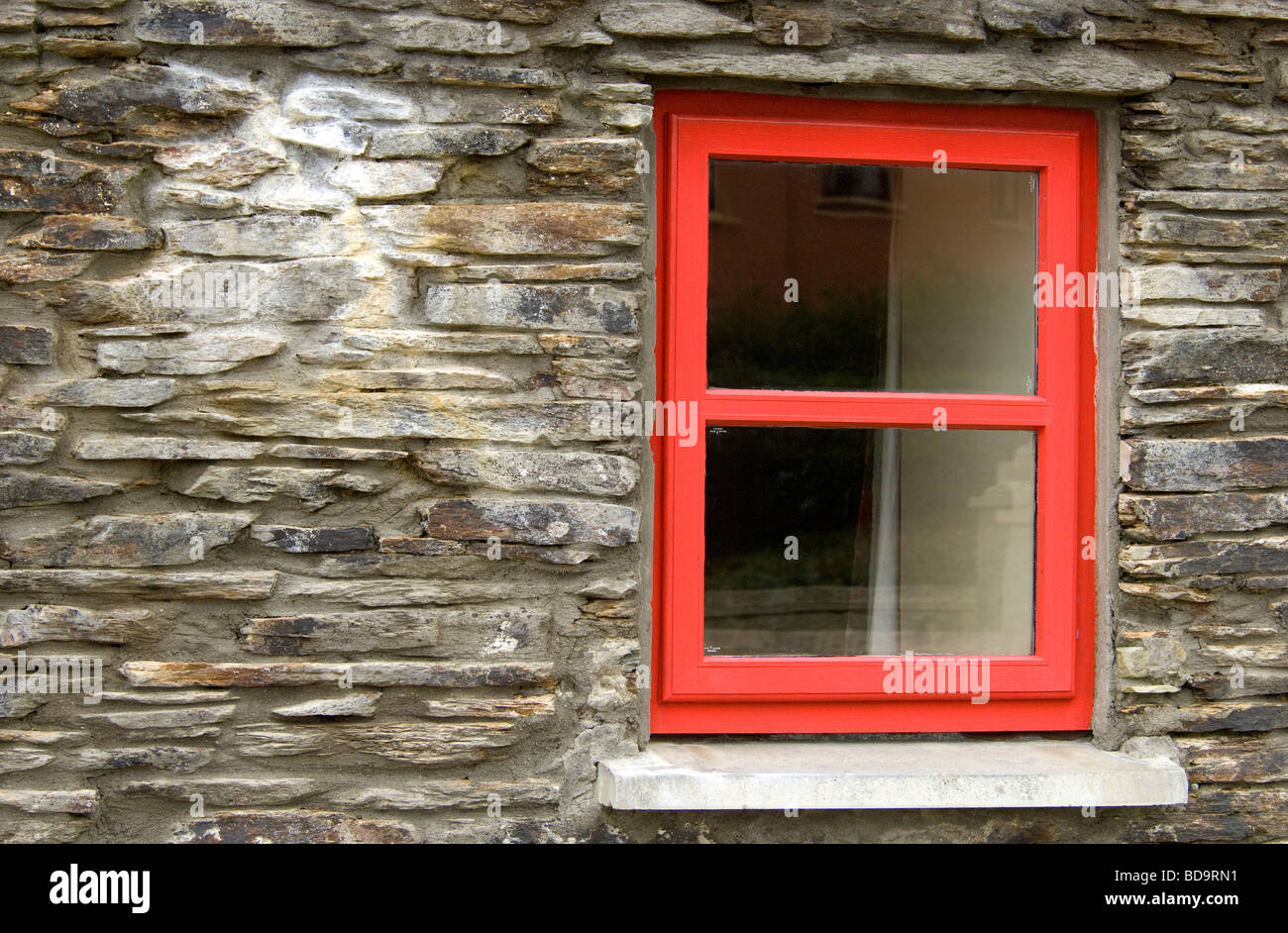 Holiday cottage with striking red windows and door, Ireland, Europe ...