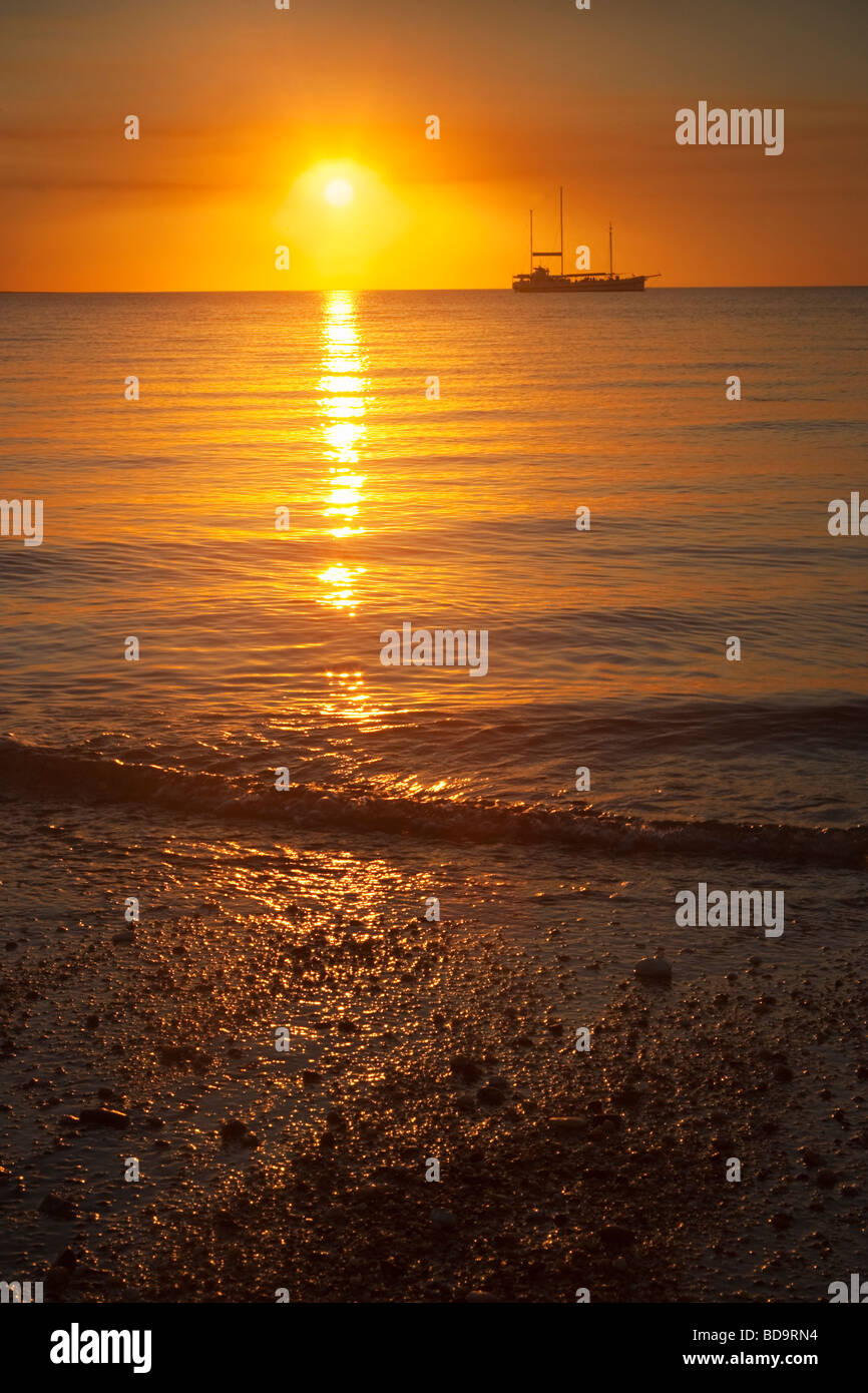 A ship sailing at sunset. Darwin, Northern Territory, Australia Stock ...