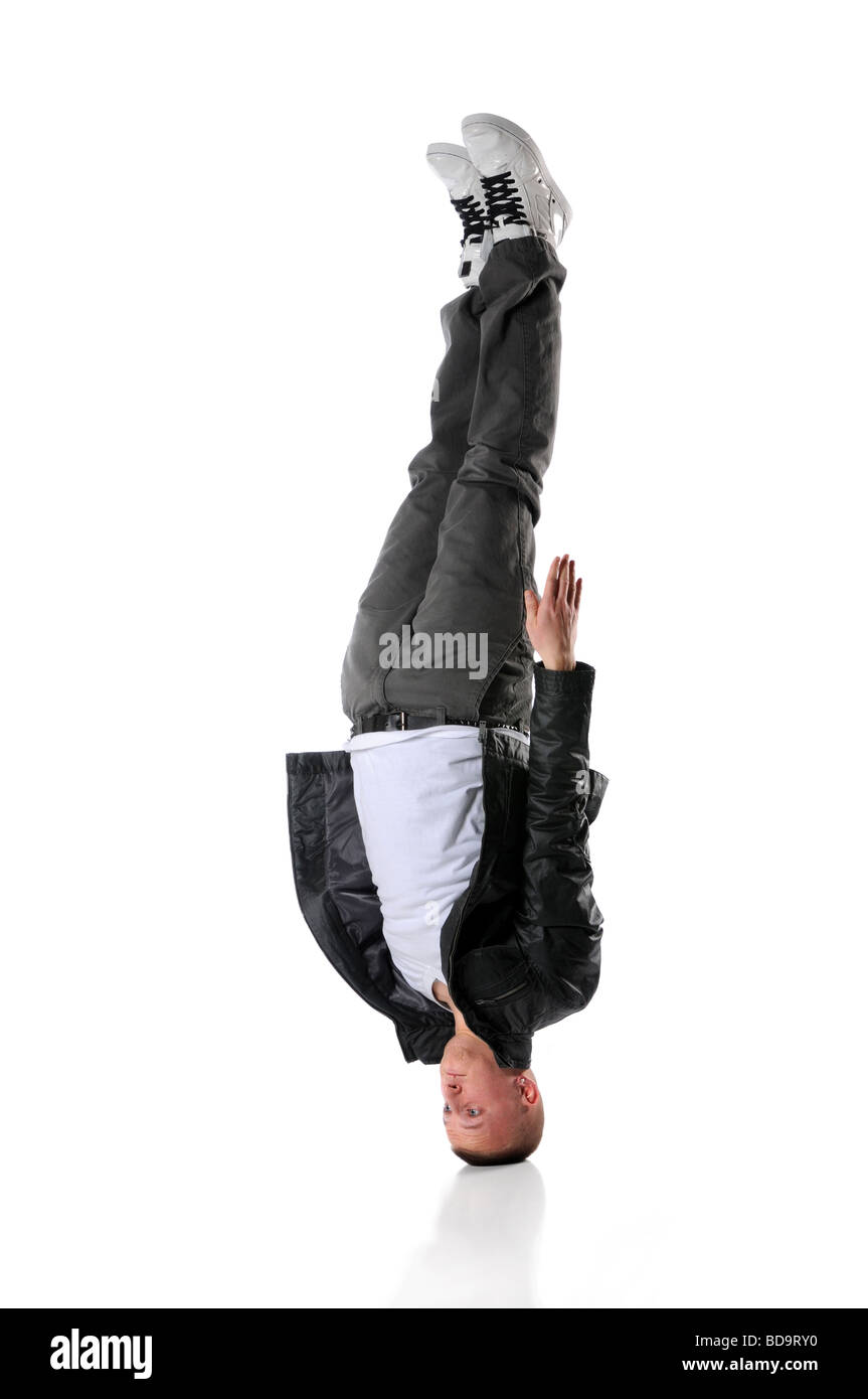 Hip hop dancer standing on head isolated over white background Stock ...