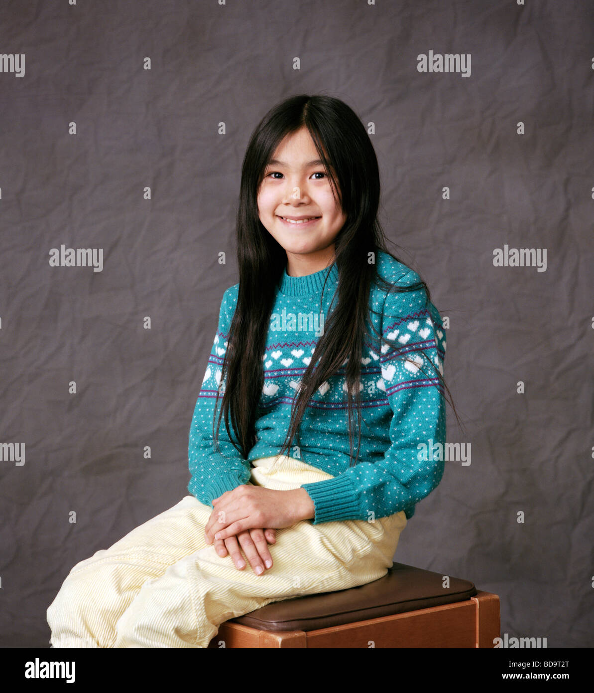 Color studio portrait of Inuit girl in a photography studio in Iqaluit ...