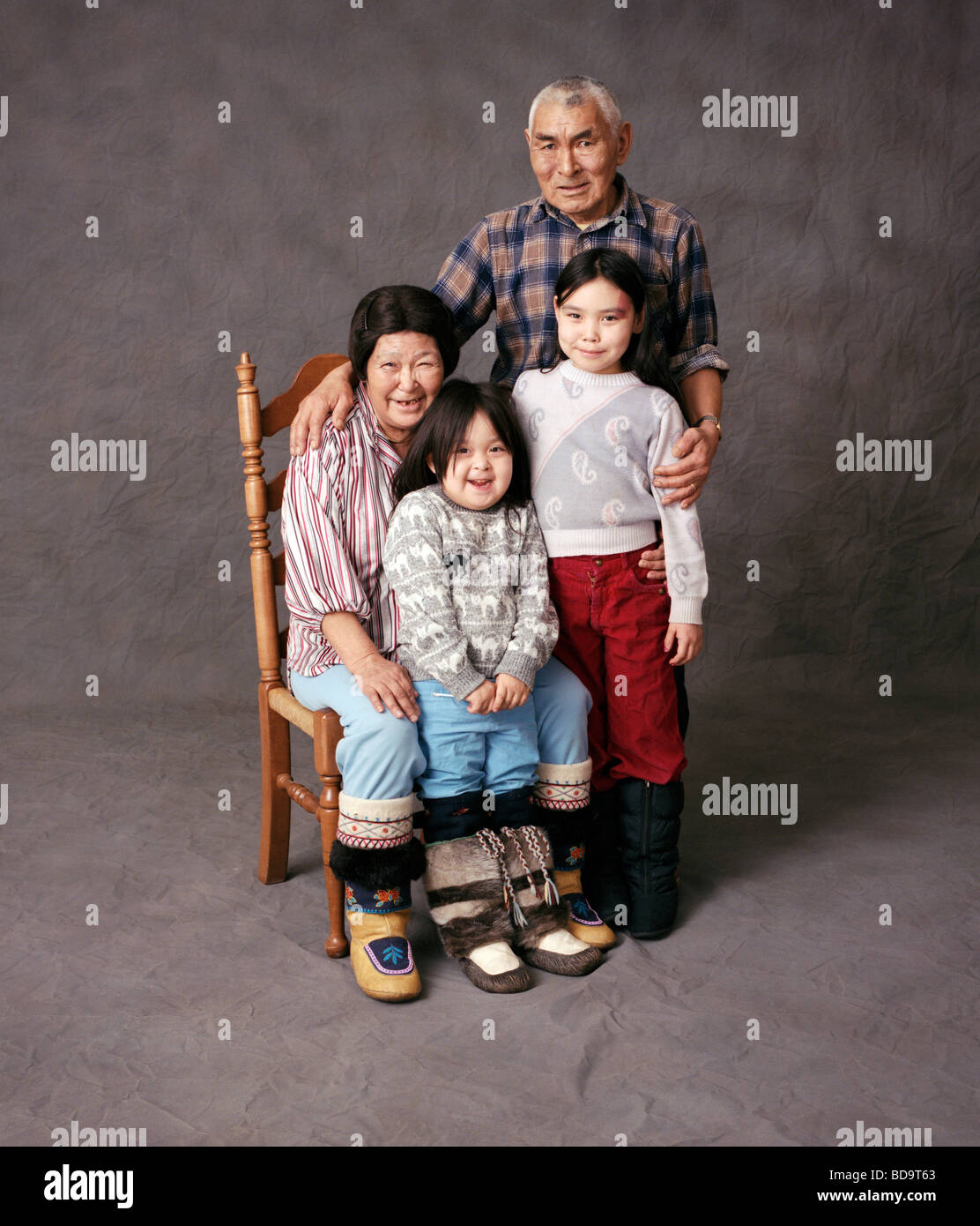 Color studio portrait of Inuit family in a photography studio in ...