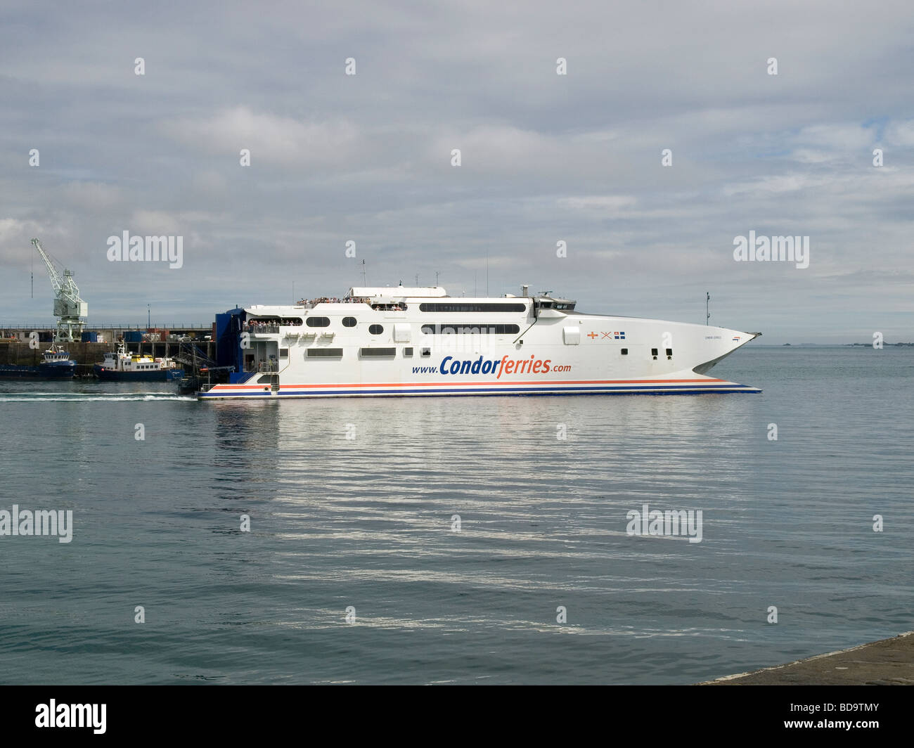 Catamaran Ferry Condor Express leaving St Peter Port harbour Guernsey Channel Islands Stock ...