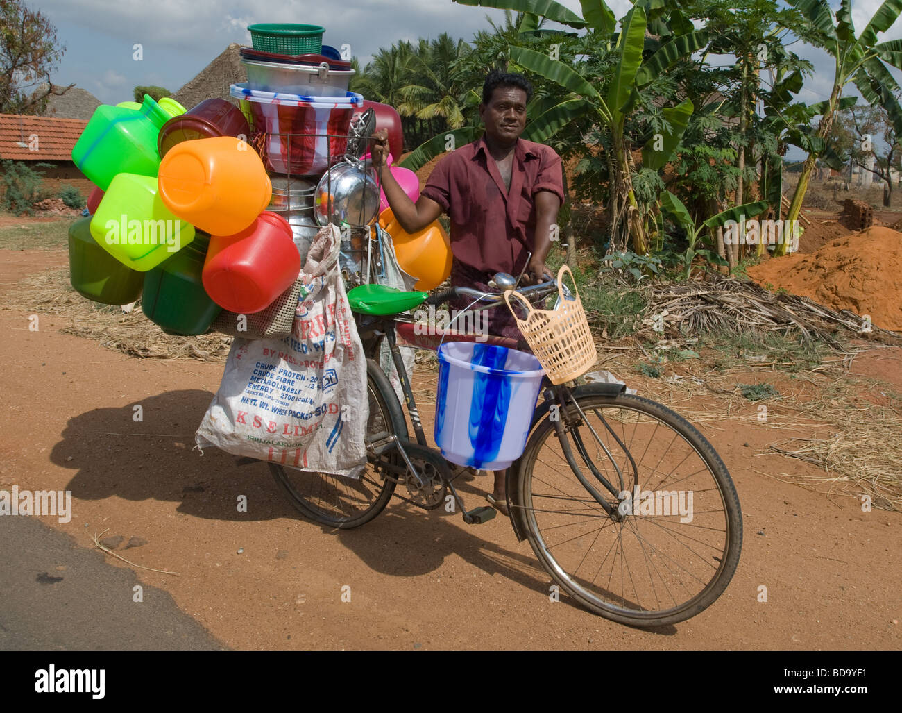 Man selling plastic buckets in Maharashtra, India Stock Photo - Alamy