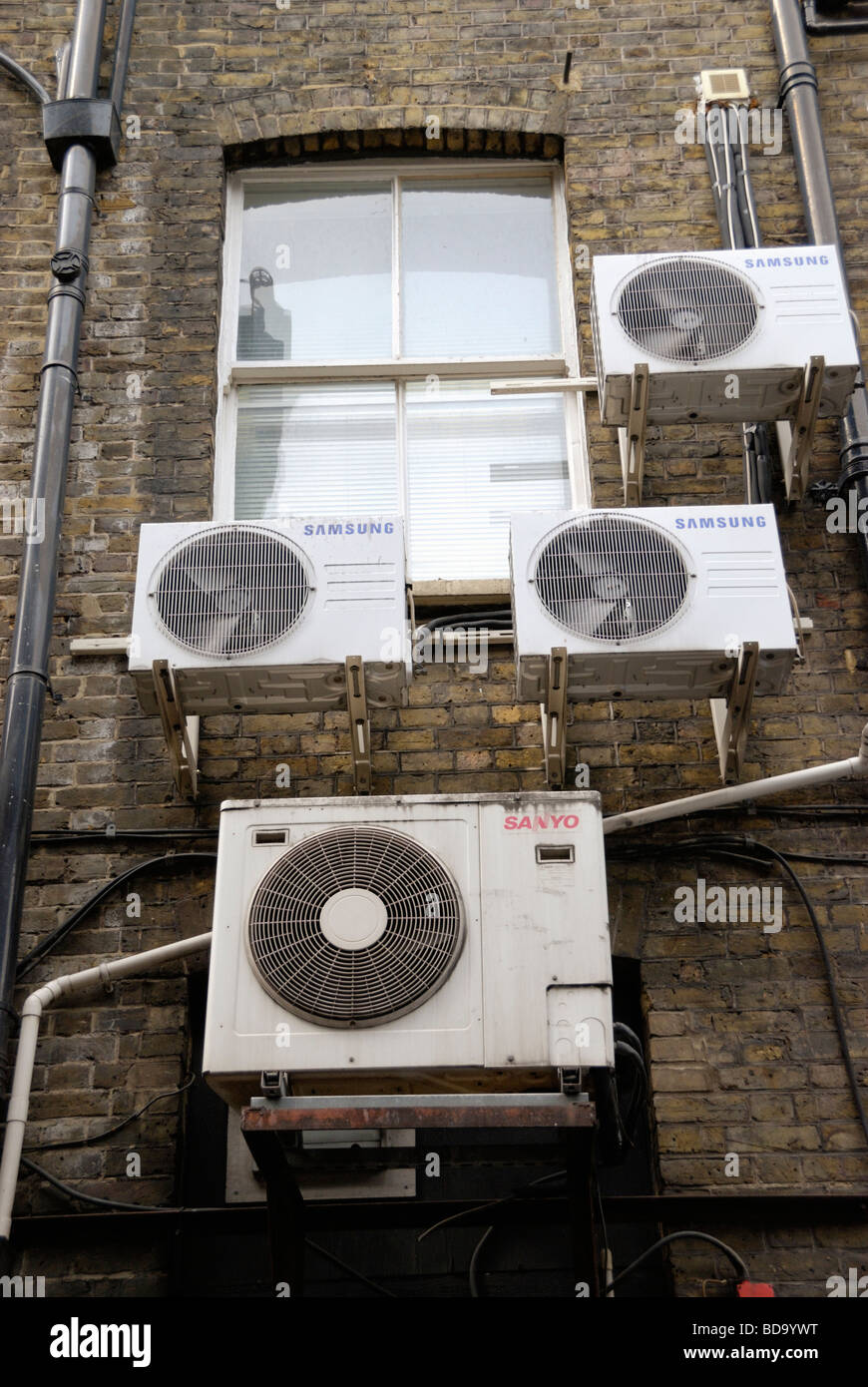 Old air conditioning units on exterior of UK building Stock Photo - Alamy