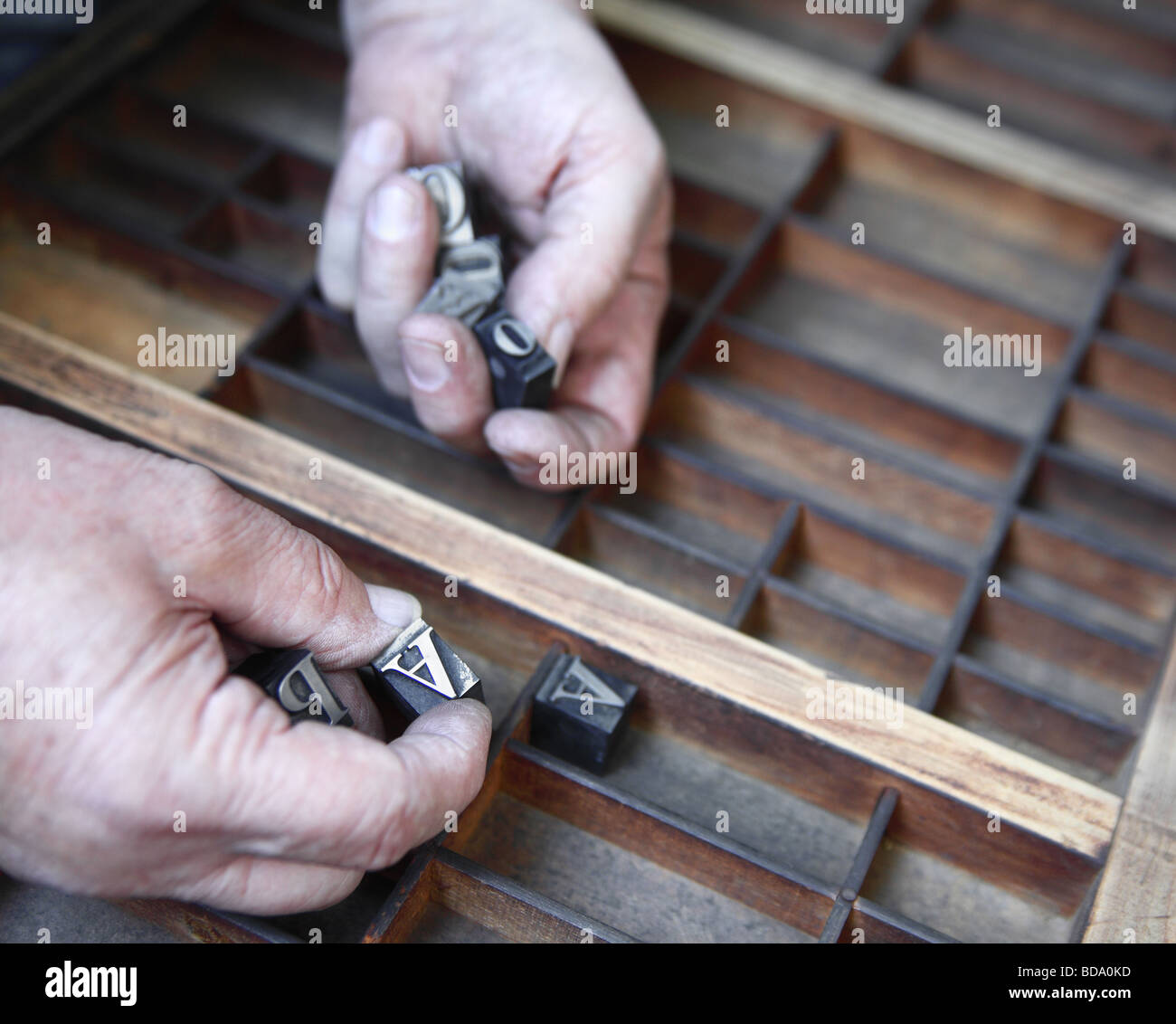 hands sorting letterpress metal type in a wood typecase Stock Photo - Alamy