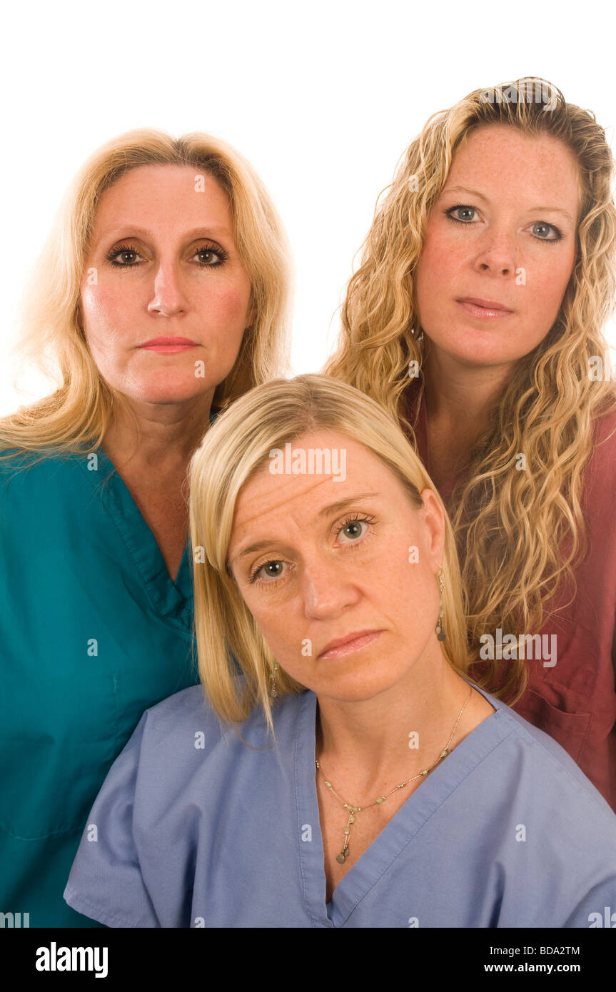 group of three pretty nurses or doctors or medical professionals ...