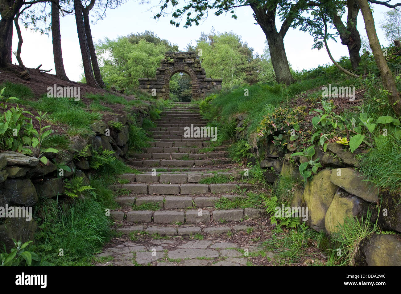Steps leading to arch in in Rivington terraced gardens Lancashire UK ...