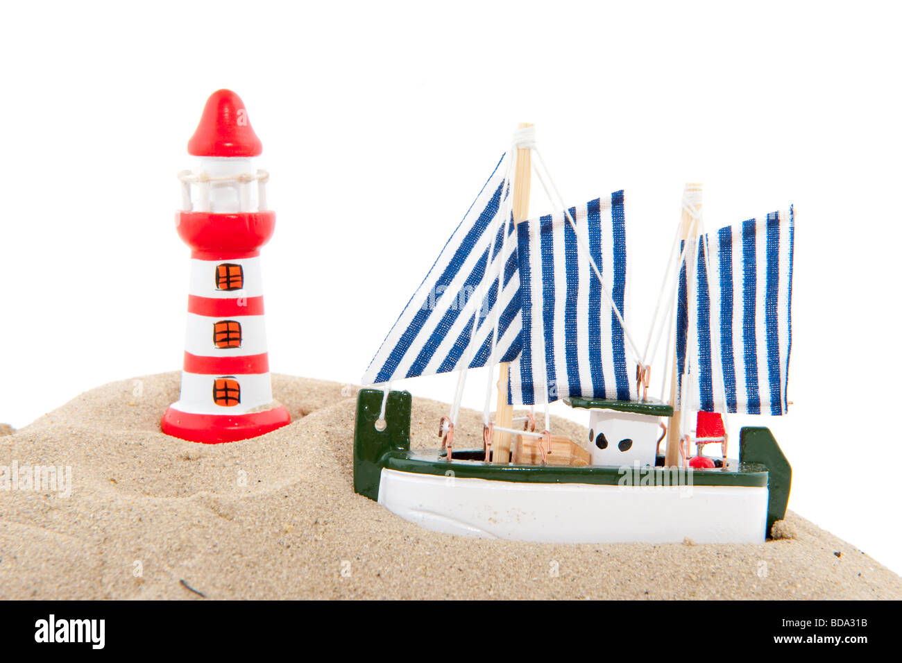 coast with beach sand lighthouse and fishing boat Stock Photo - Alamy