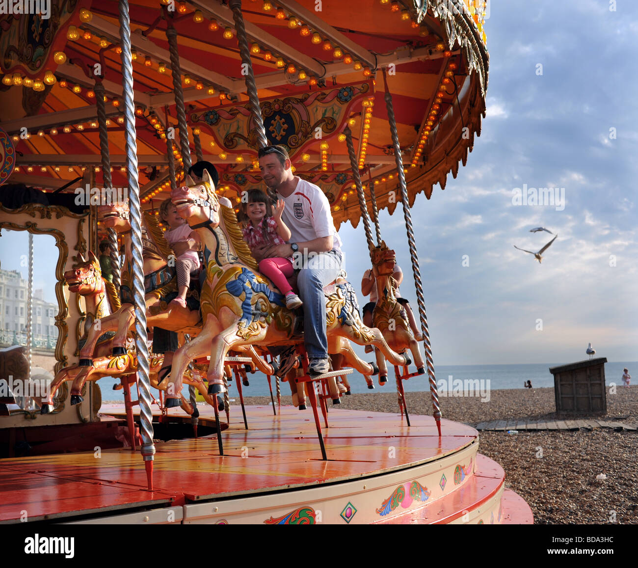 Fun on the carousel ride along Brighton seafront beach - UK Stock Photo ...