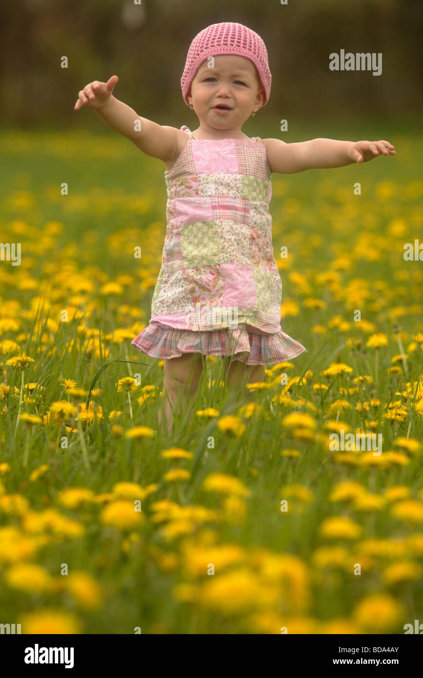 Baby ,girl,in a spring meadow Stock Photo - Alamy