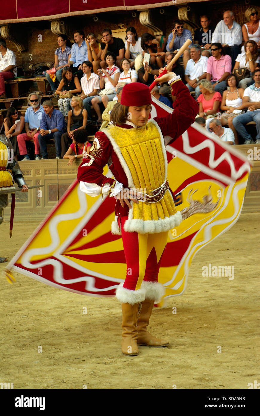 Flag thrower of the Snail Contrada Siena Palio, a twice yearly event of ...
