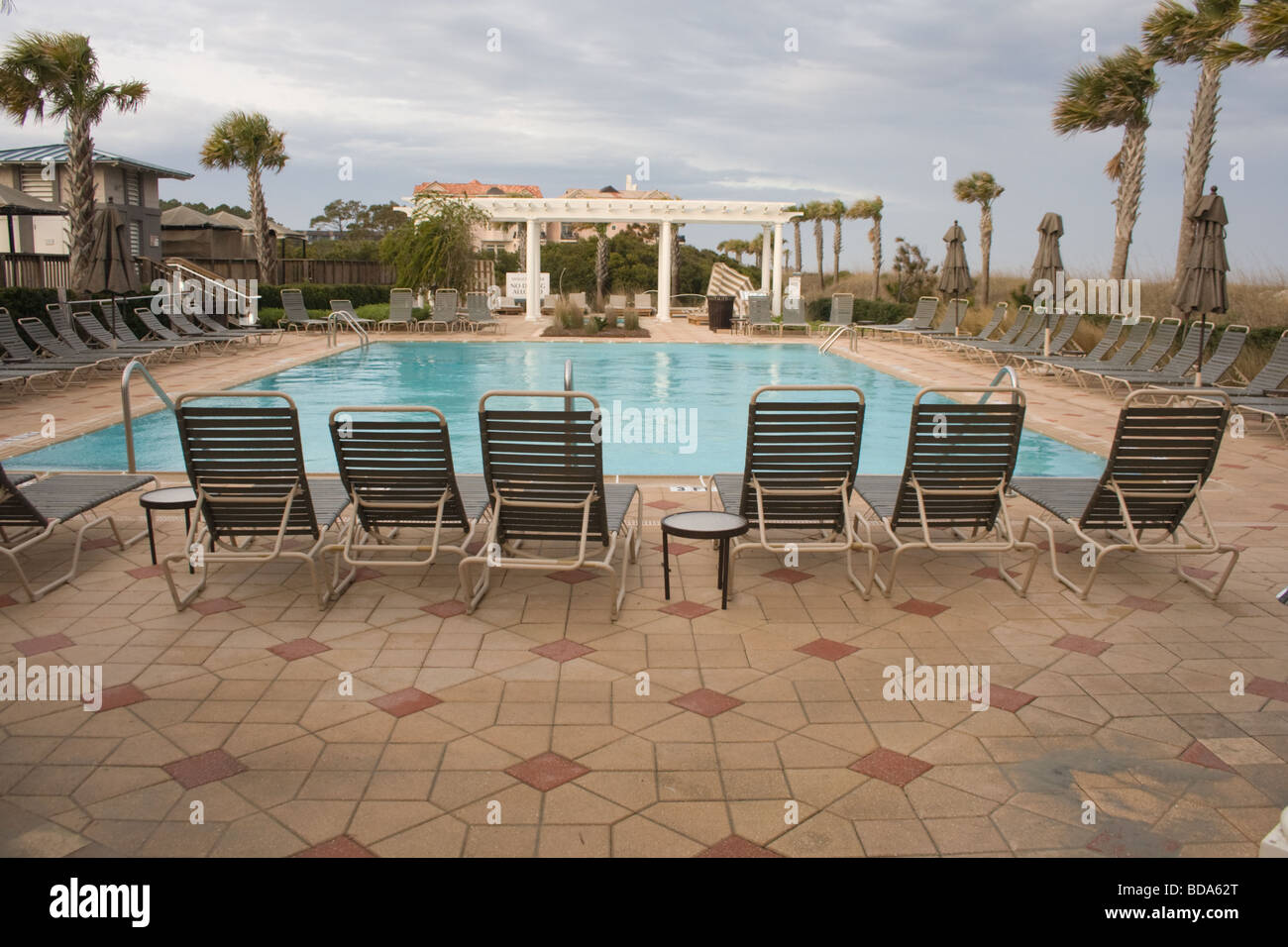 Infinity Pool and Pool Deck with Chaise Lounges All Ready for Customers ...