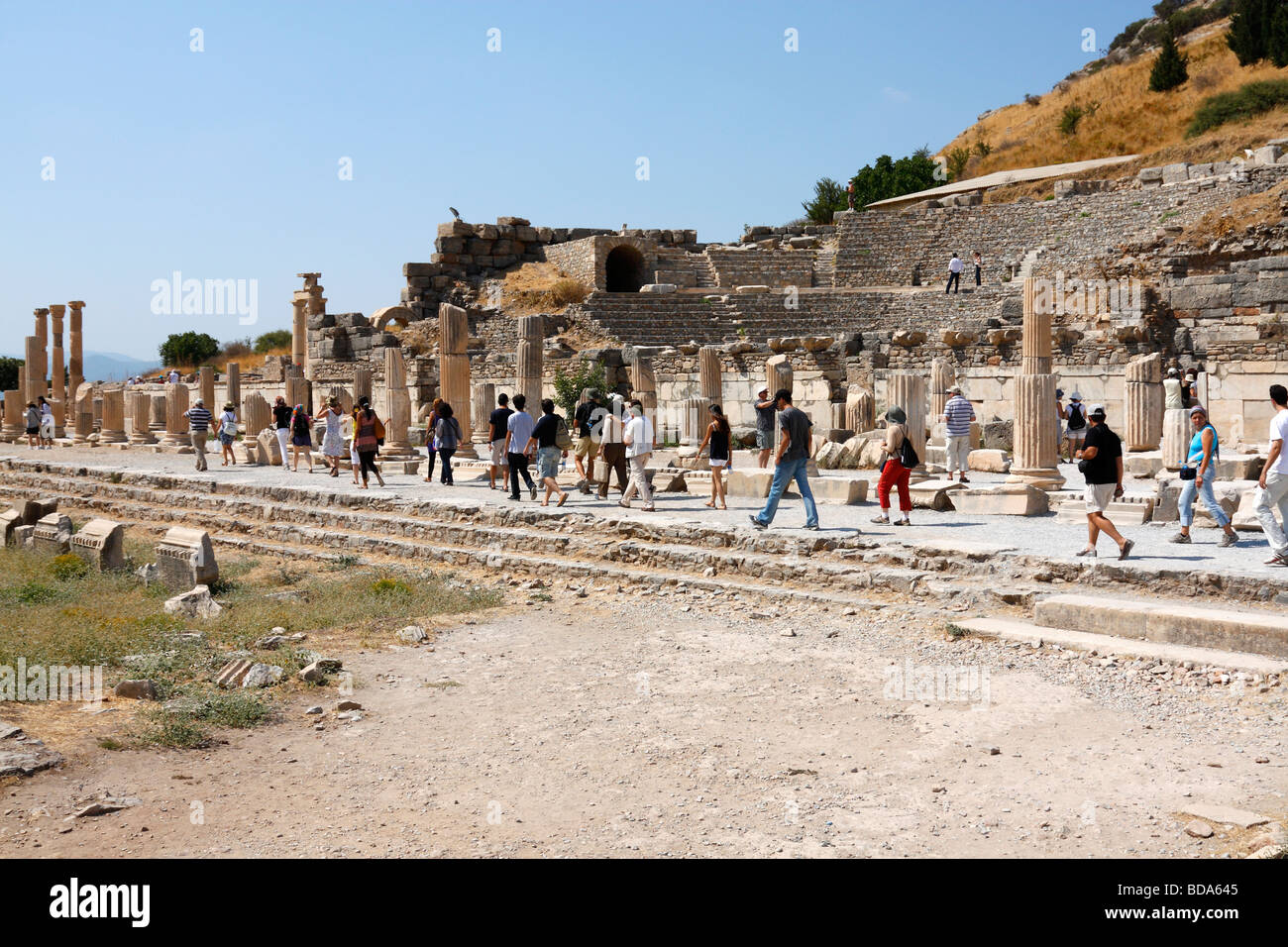Tourist group visiting Ephesus antique (ancient) city ruins. Turkey ...