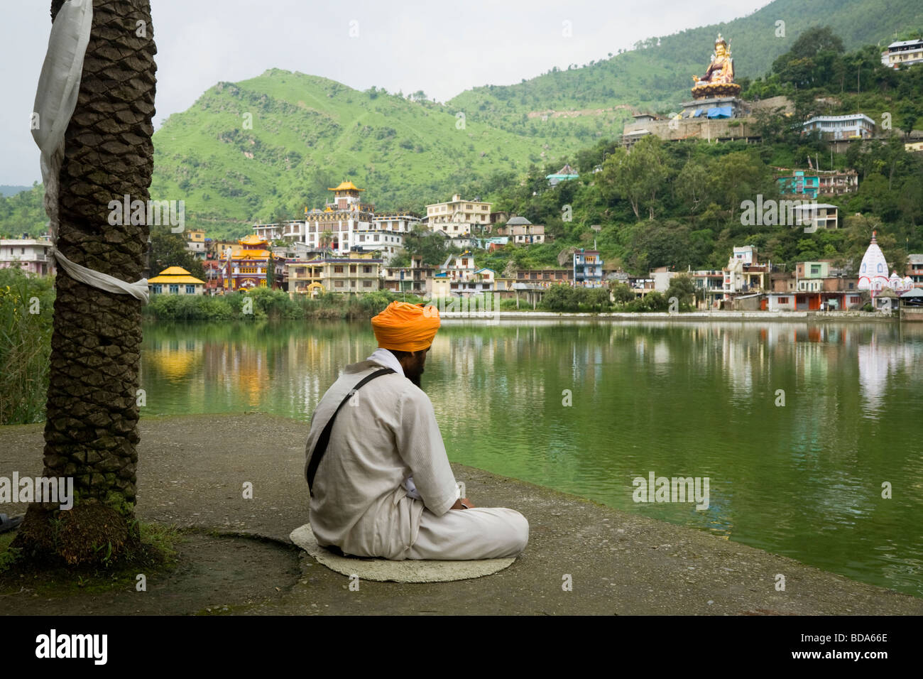 Sikh man meditates beside Rewalsar lake. Rewalsar. India Stock Photo ...