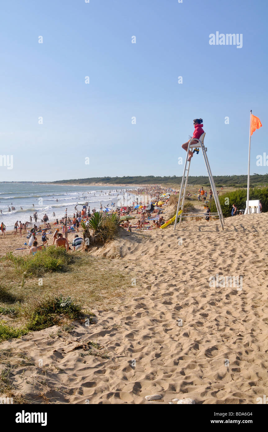 Supervised swimming. Sitting on his watch chair, the lifeguard watches ...