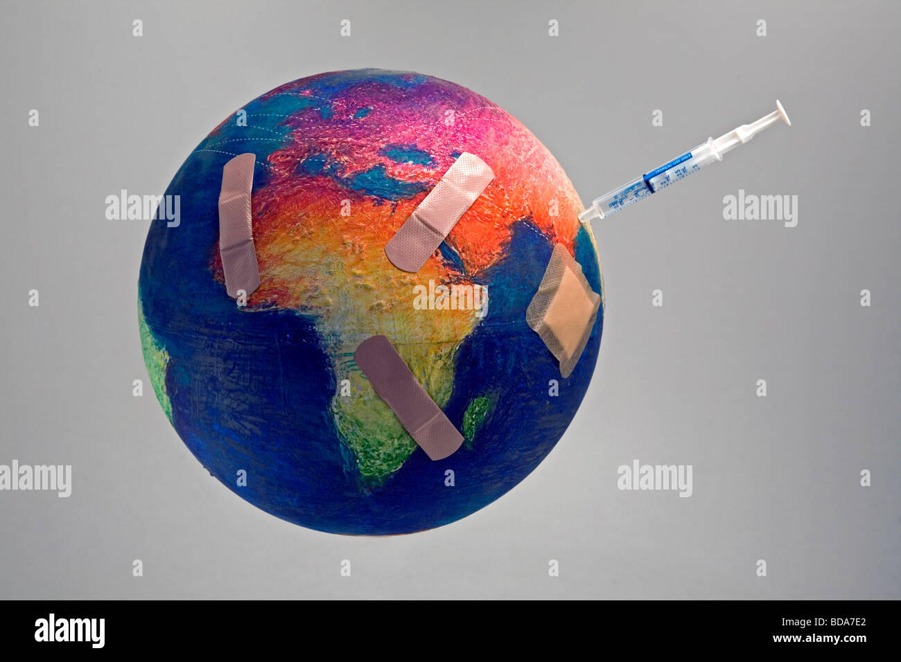 Earth globe band aid hi-res stock photography and images - Alamy