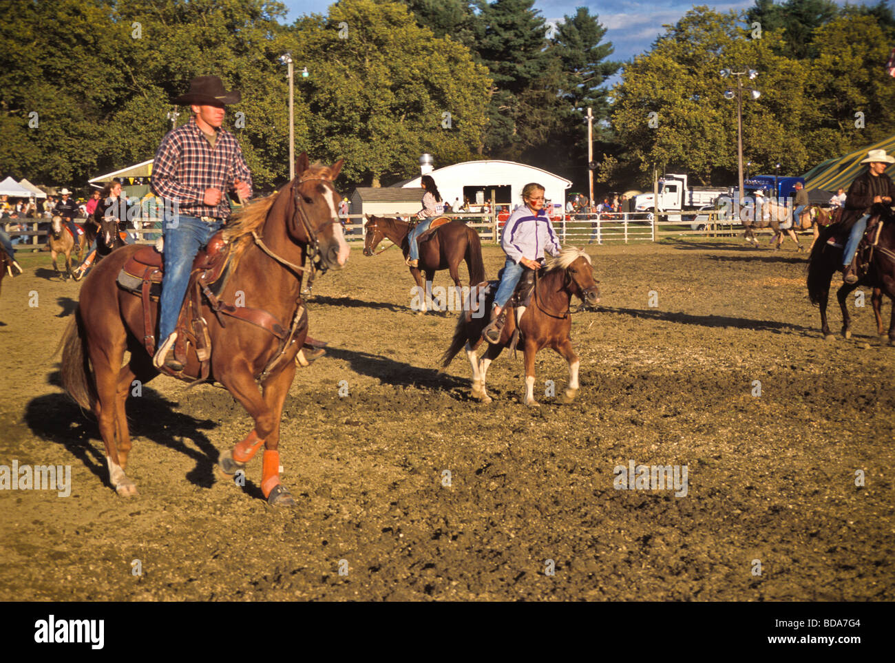 Riders in judging ring of county fair rodeo Stock Photo - Alamy