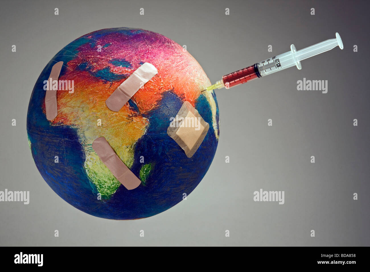 Earth globe band aid hi-res stock photography and images - Alamy