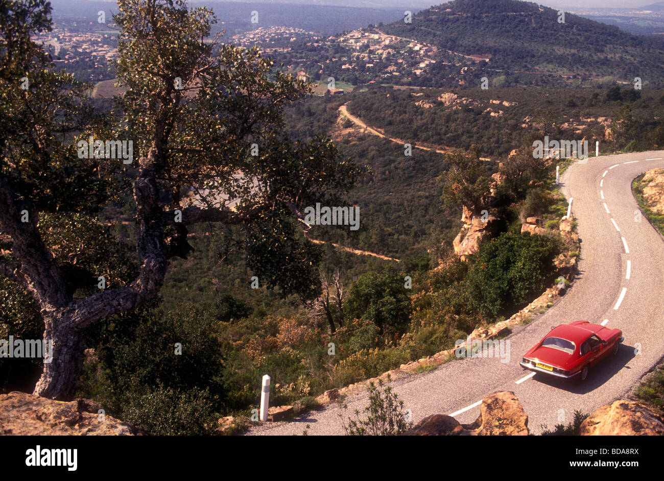 Car driving along a French country road in Provence France Stock Photo ...