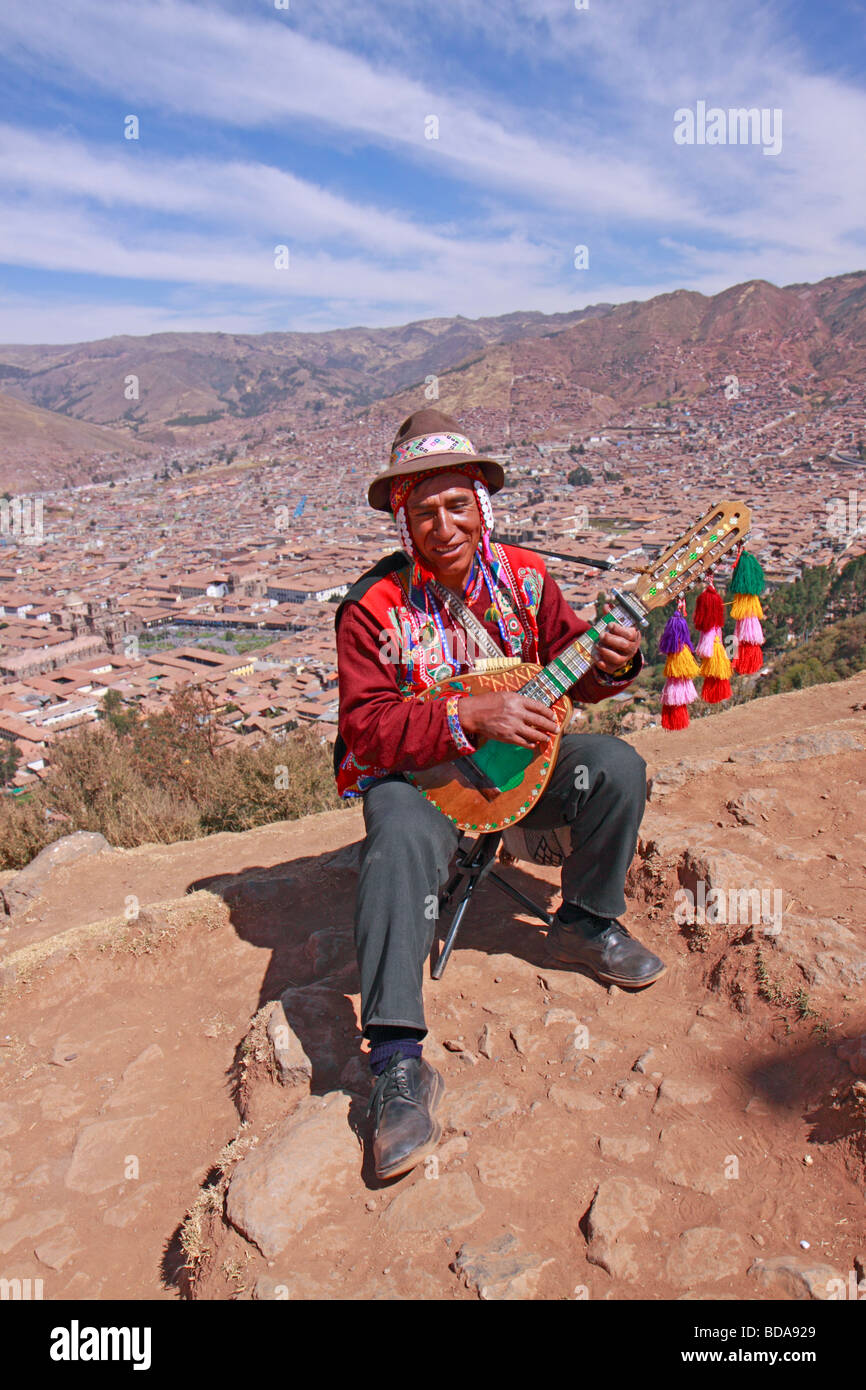 native man playing the guitar at a viewpoint, Cuzco, Peru, South ...