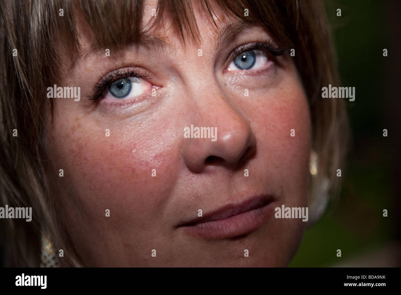 Woman face looking to the camera Stock Photo - Alamy