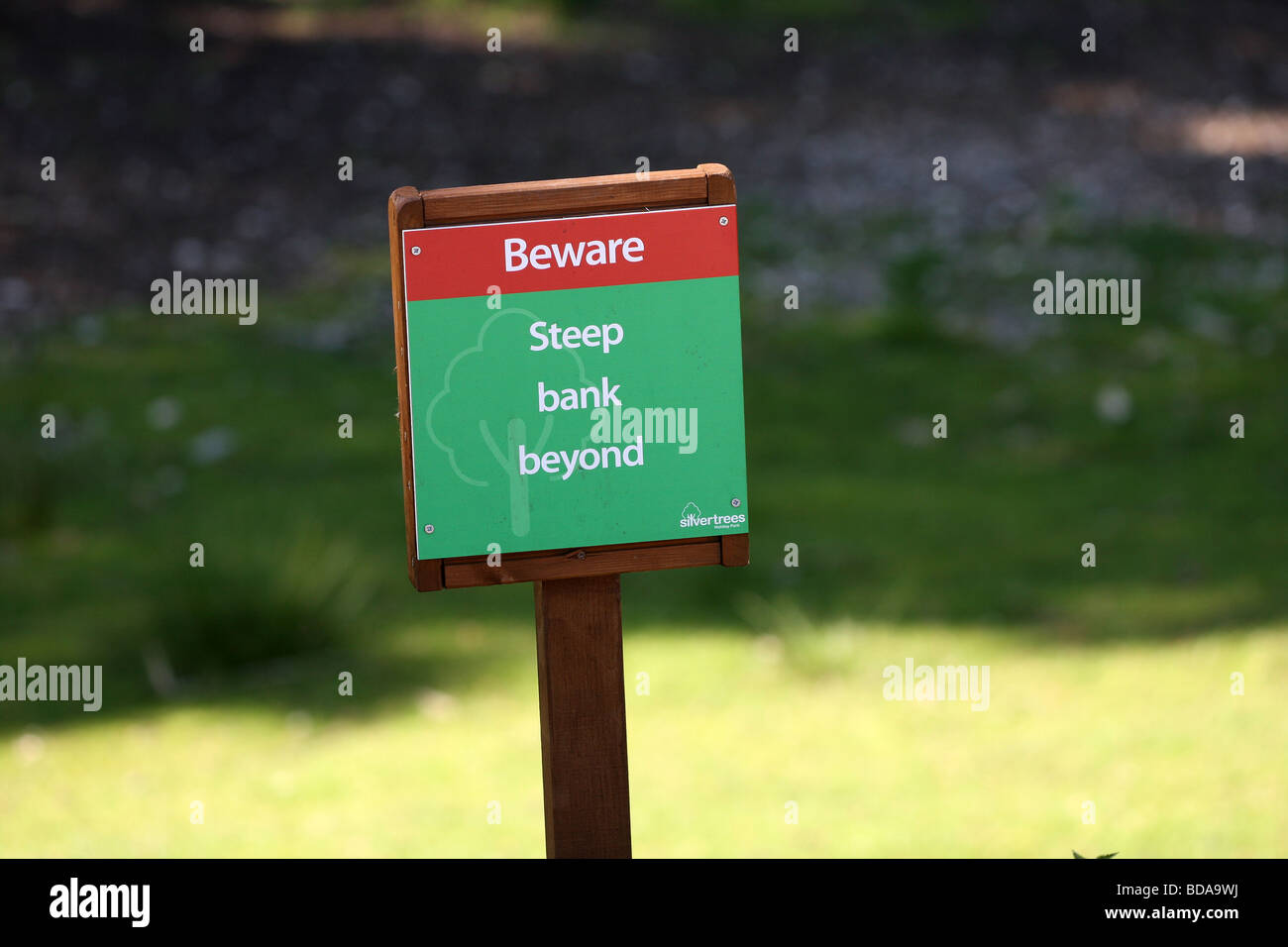 Safety warning sign for steep edge Stock Photo - Alamy