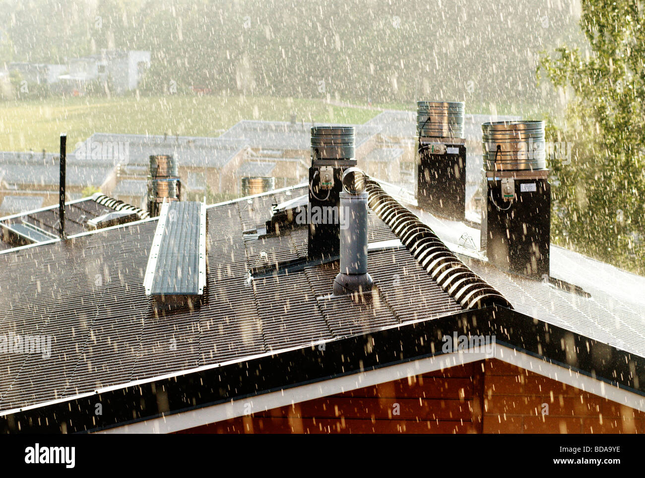 Pouring rain and roofs Stock Photo - Alamy