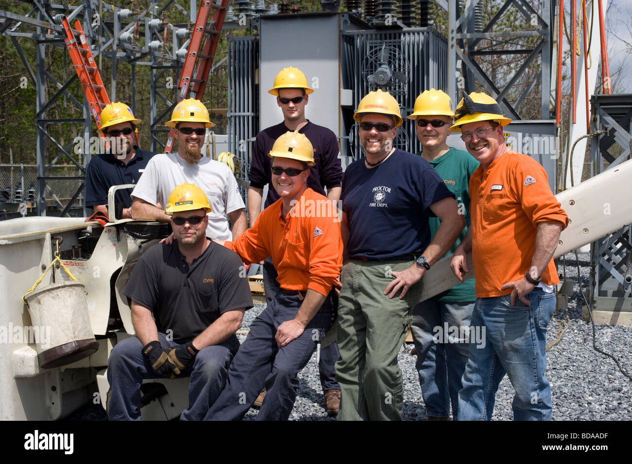 Electrical utility workmen posing for a group portrait Stock Photo - Alamy