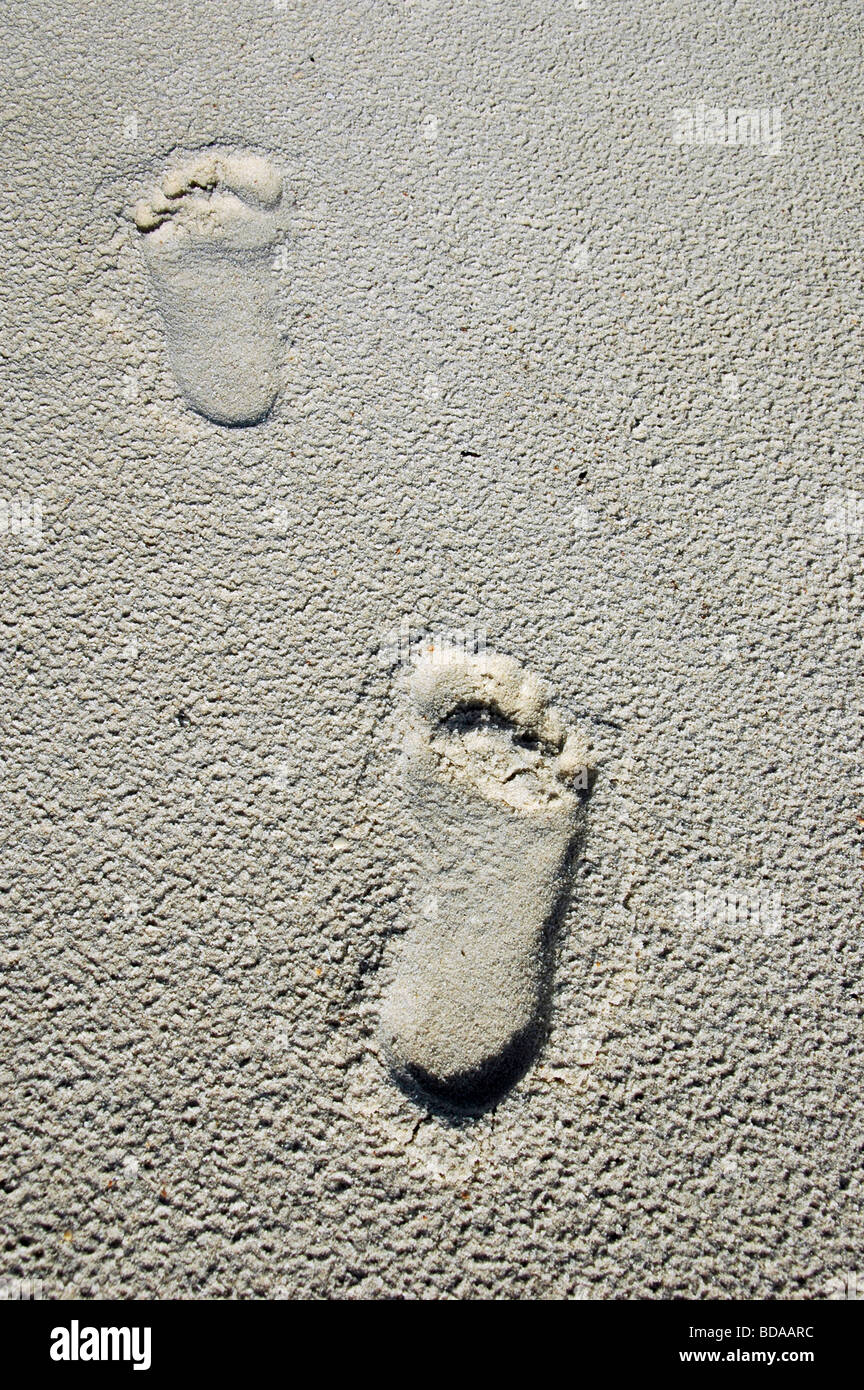 Two footprints on the sand Stock Photo - Alamy