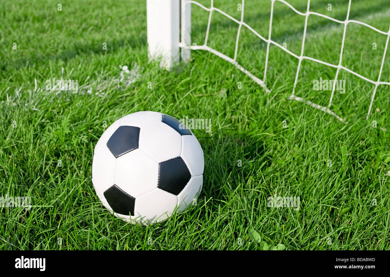 Football in the goal net Stock Photo - Alamy