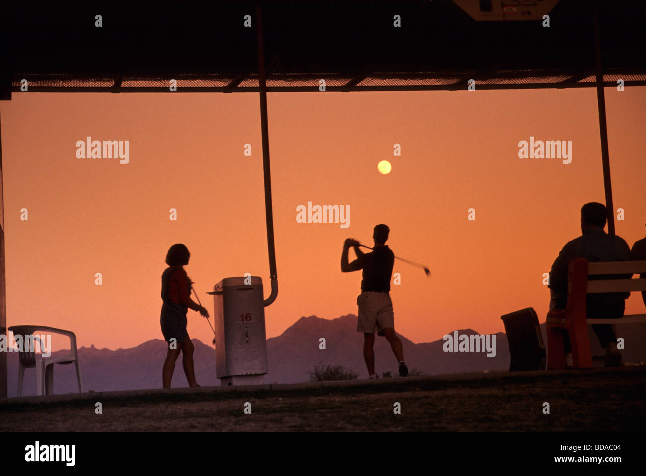 Golfer at Driving Range Stock Photo - Alamy