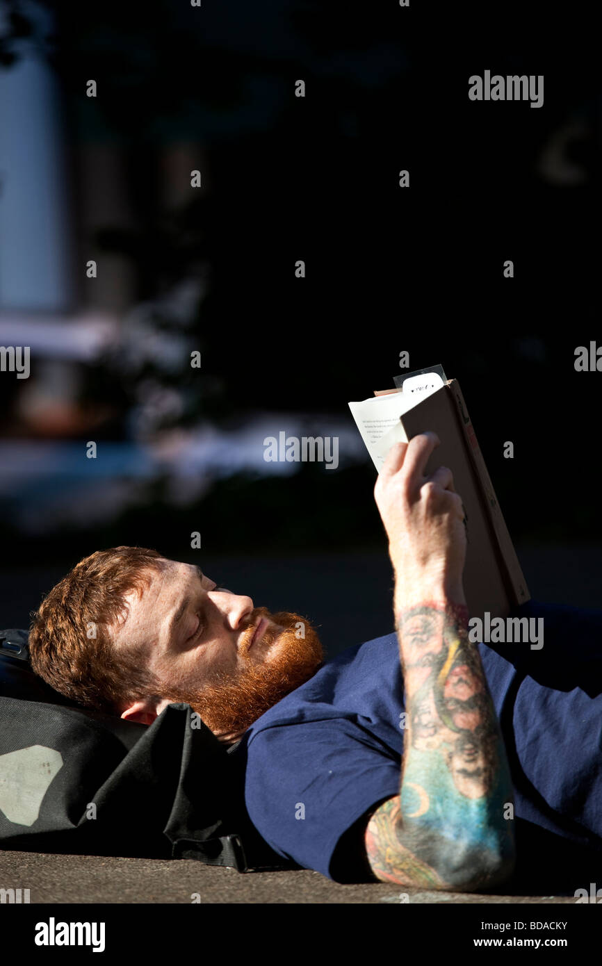 Vertical shot young man reading hi-res stock photography and images - Alamy