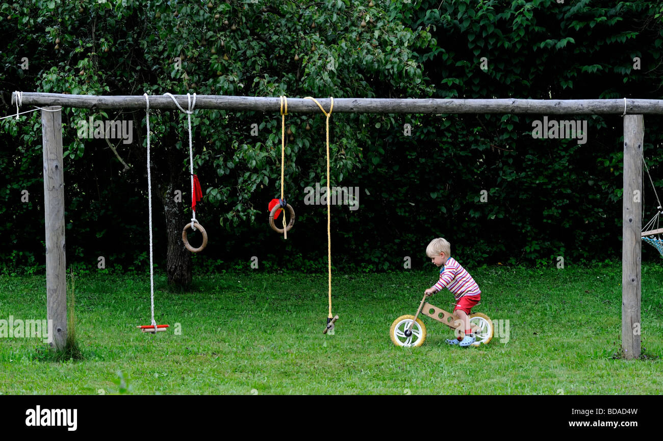 Little child boy riding a bounce bicycle Stock Photo - Alamy