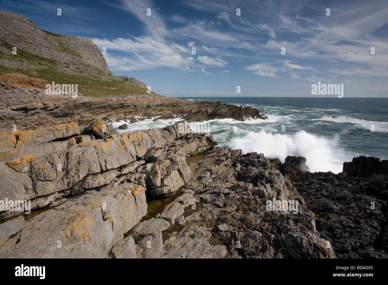 Atlantic waves crash against the Limestone cliffs and rocks overlooking ...