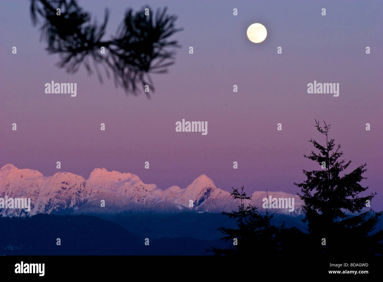 Full moon over snow capped hi-res stock photography and images - Alamy