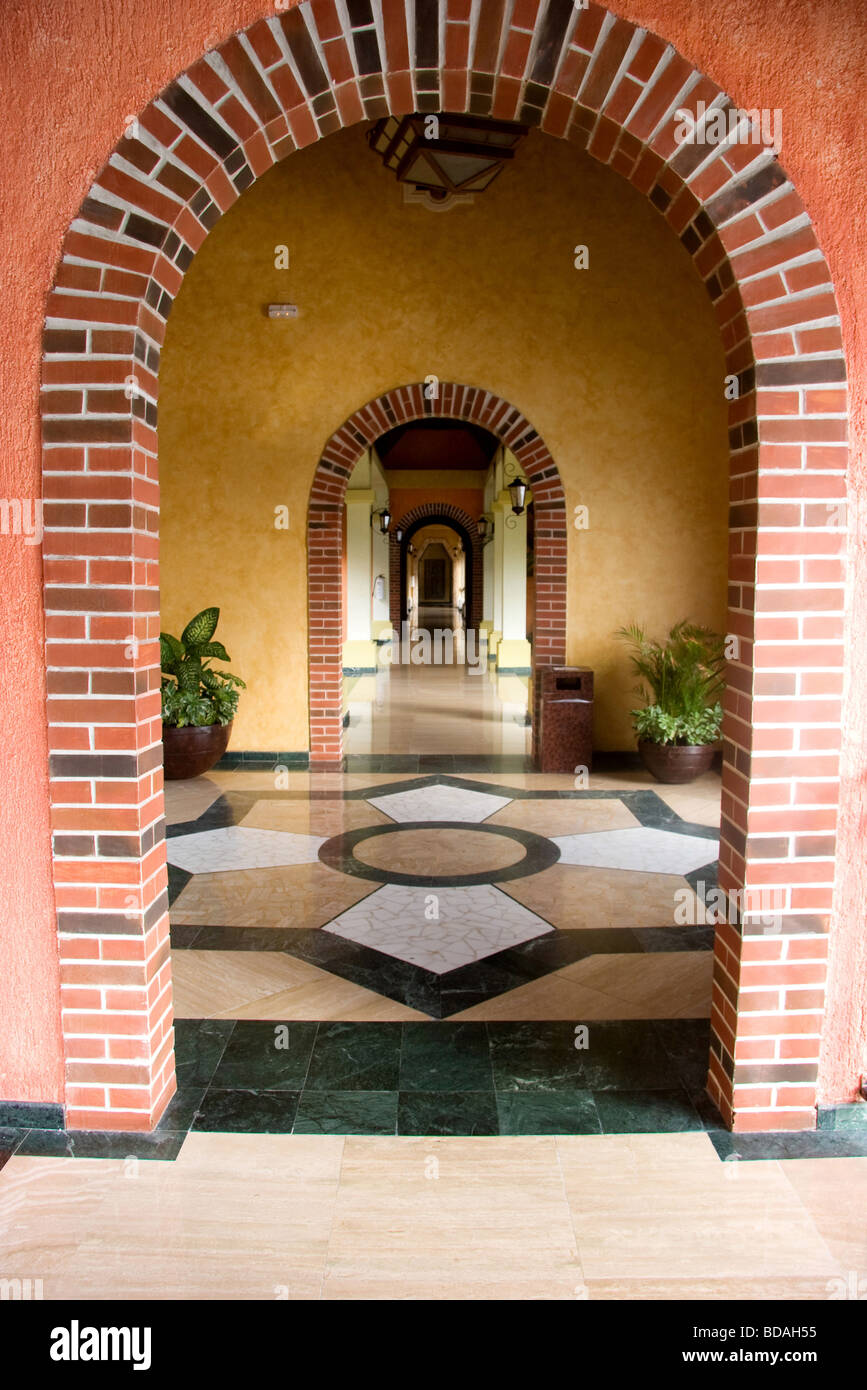 Long hallway or colonnade with sequence of arched doorways and t Stock ...