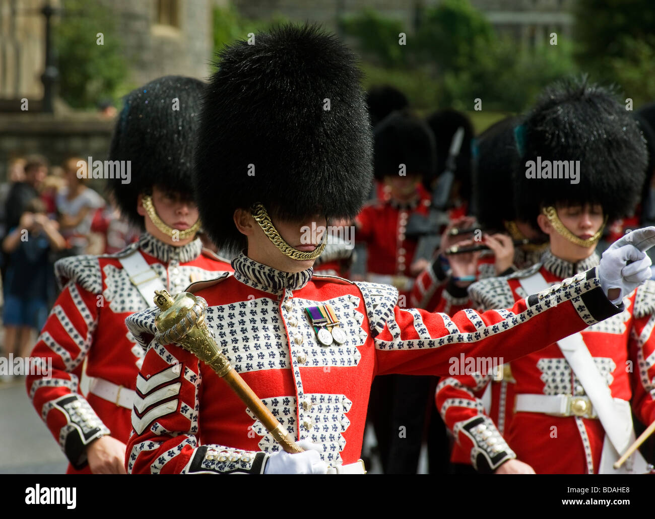 Soldiers marching wearing bearskins outside Windsor Castle Stock Photo ...