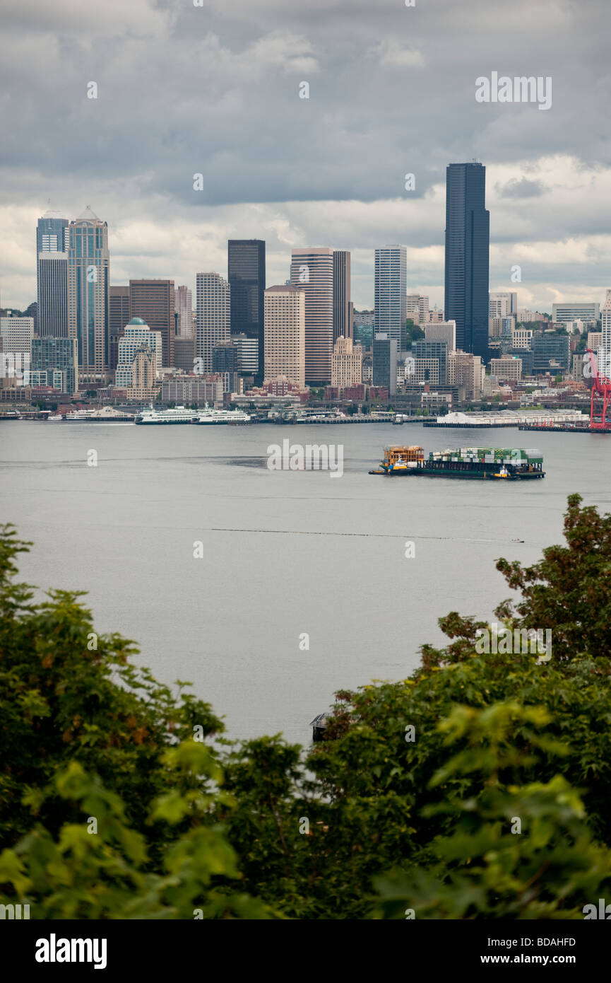 The Seattle skyline as seen from West Seattle. Ships and boats ply the ...