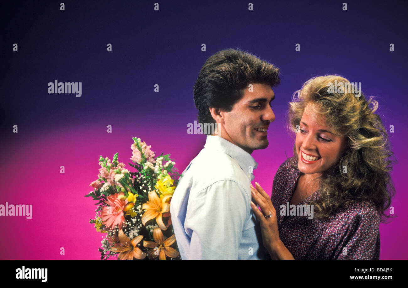 Fiancée brings gift of flower bouquet to his girl friend Stock Photo ...