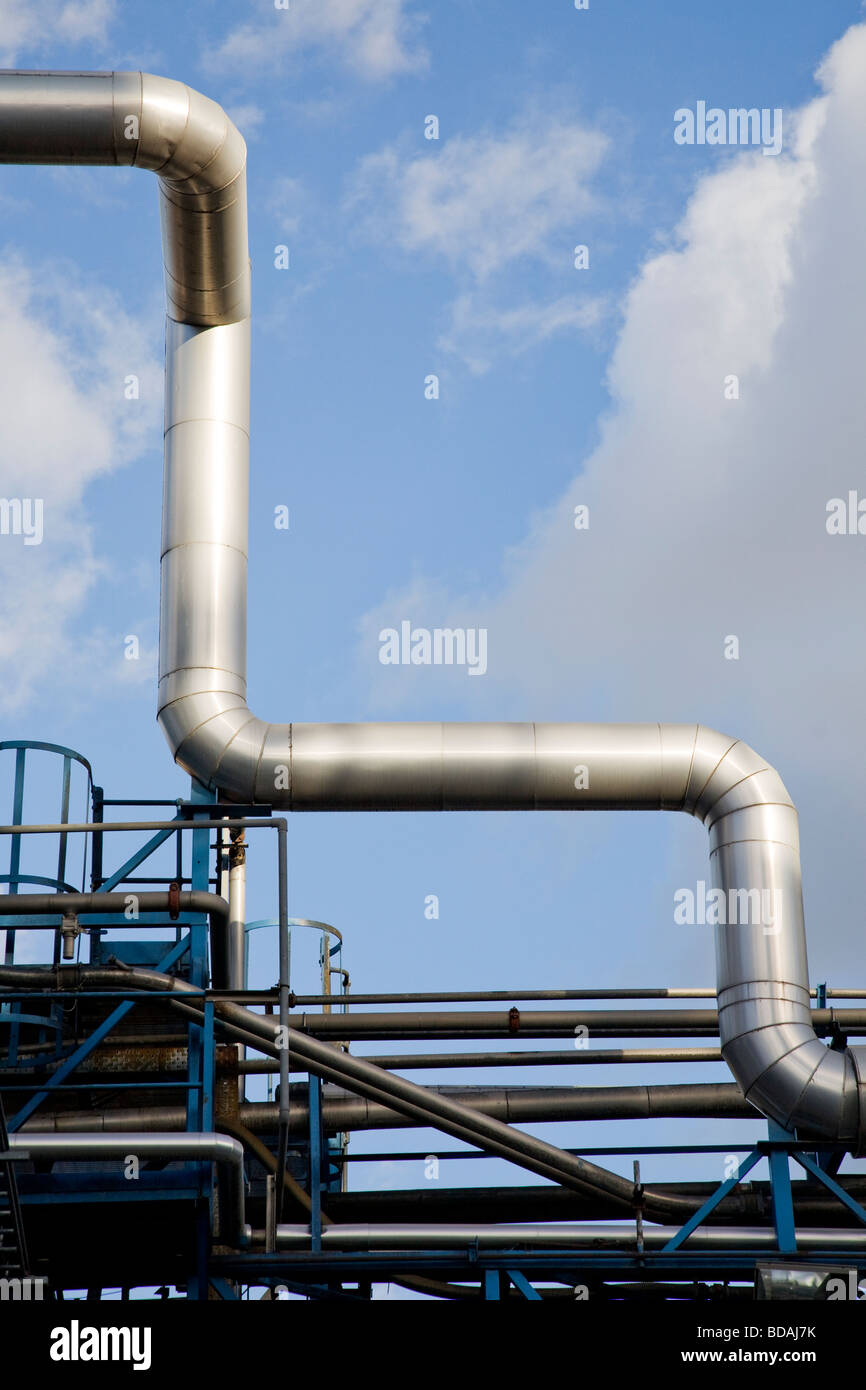 Lagged external pipework in a food factory Stock Photo - Alamy